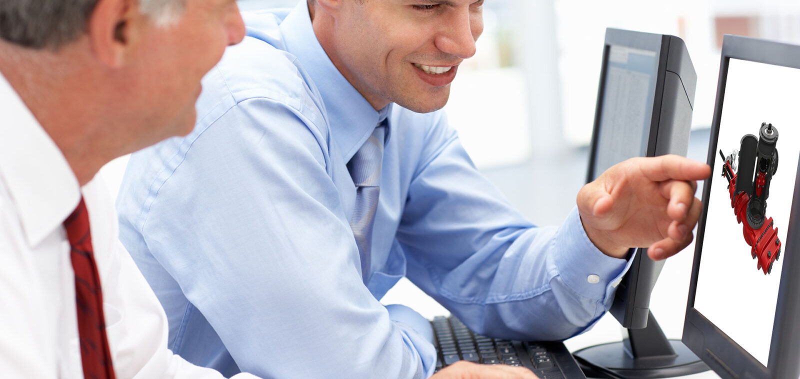 Businessmen pointing to monitor-82602301-edit-crop1 - DeltaValve, LLC